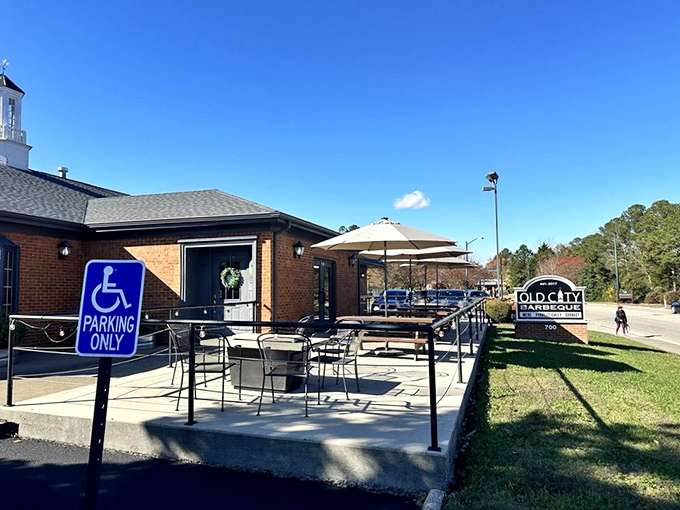 Blue skies frame the outdoor seating area – nature's perfect backdrop for the smoke-infused feast that awaits inside.