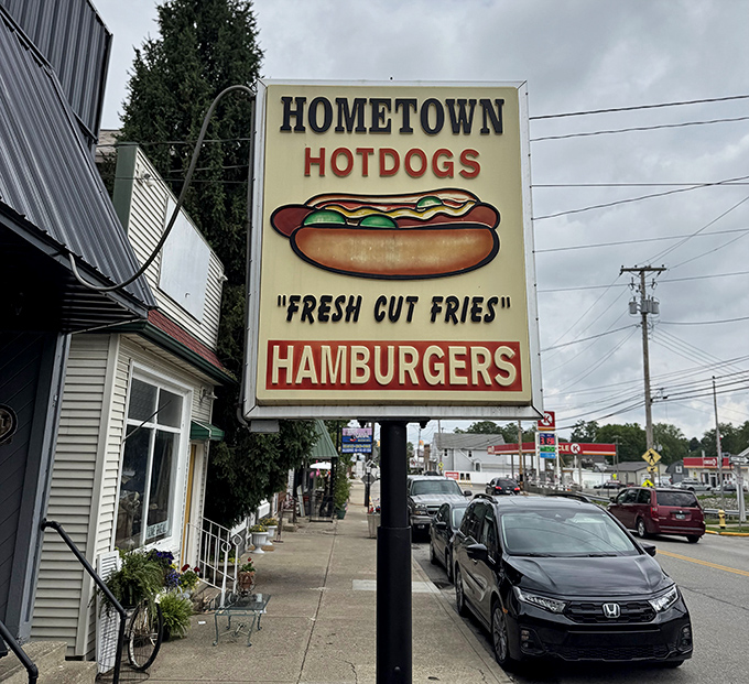 That sign says it all—"Fresh Cut Fries" isn't just a slogan, it's a solemn promise. The hot dog illustration looks like it's winking at hungry passersby.