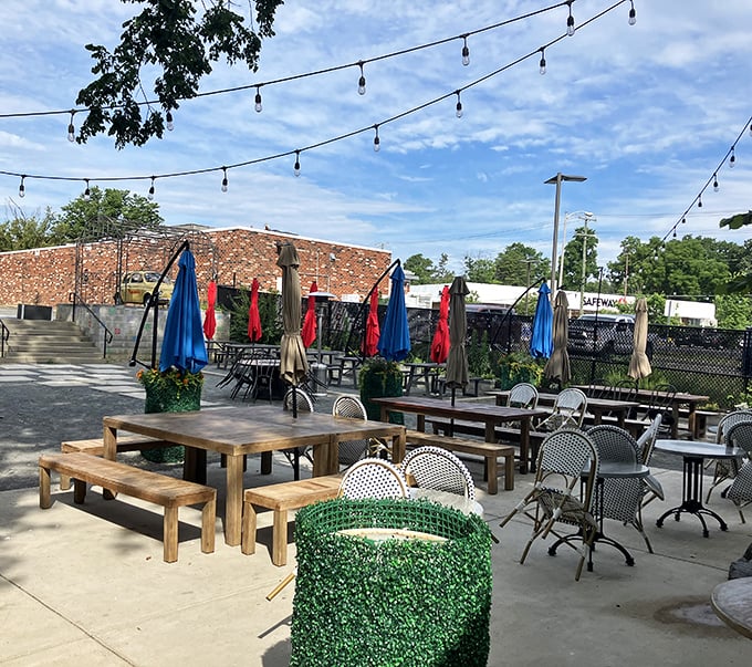 Outdoor dining that feels like stumbling upon a secret Italian courtyard. Those string lights aren't decoration—they're pizza ambiance infrastructure. 
