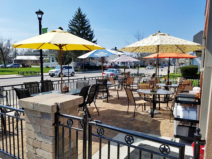 Bright umbrellas and fresh air create the perfect outdoor setting for enjoying delicious food and relaxing with friends.