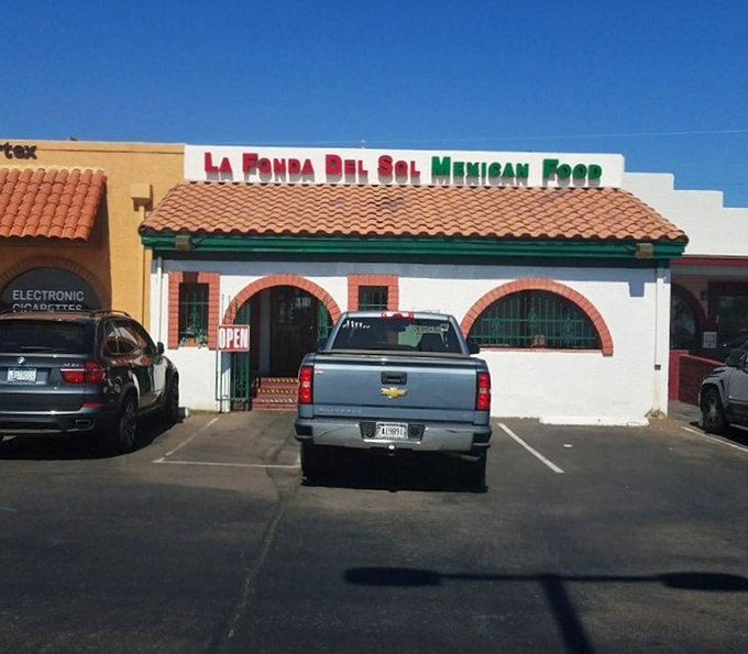 Even from the parking lot, La Fonda Del Sol's distinctive signage and architecture promise authentic Mexican flavors that are worth the trip.