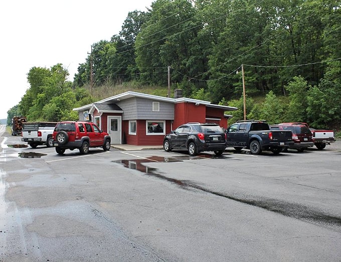 A parking lot filled with trucks and SUVs—the universal sign of good food ahead. Local vehicles know exactly where to find comfort on a plate.