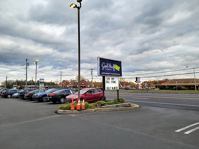 The parking lot view—your first clue that something special awaits. That sign promises good stuff, and Pennsylvania thrifters know it delivers.