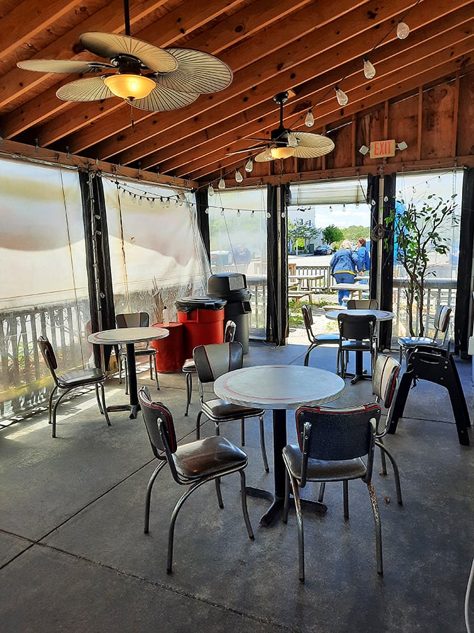 The screened porch offers the best of both worlds – protection from the elements while maintaining that essential vacation vibe.