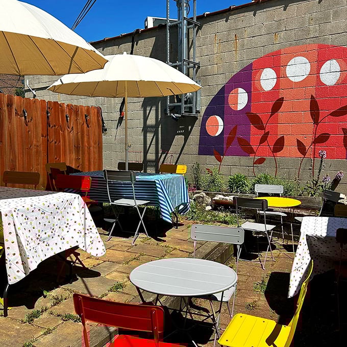 A cheerful patio adorned with colorful tables, chairs, and umbrellas. When Ohio's weather cooperates, this little urban oasis becomes the hottest seat in town.