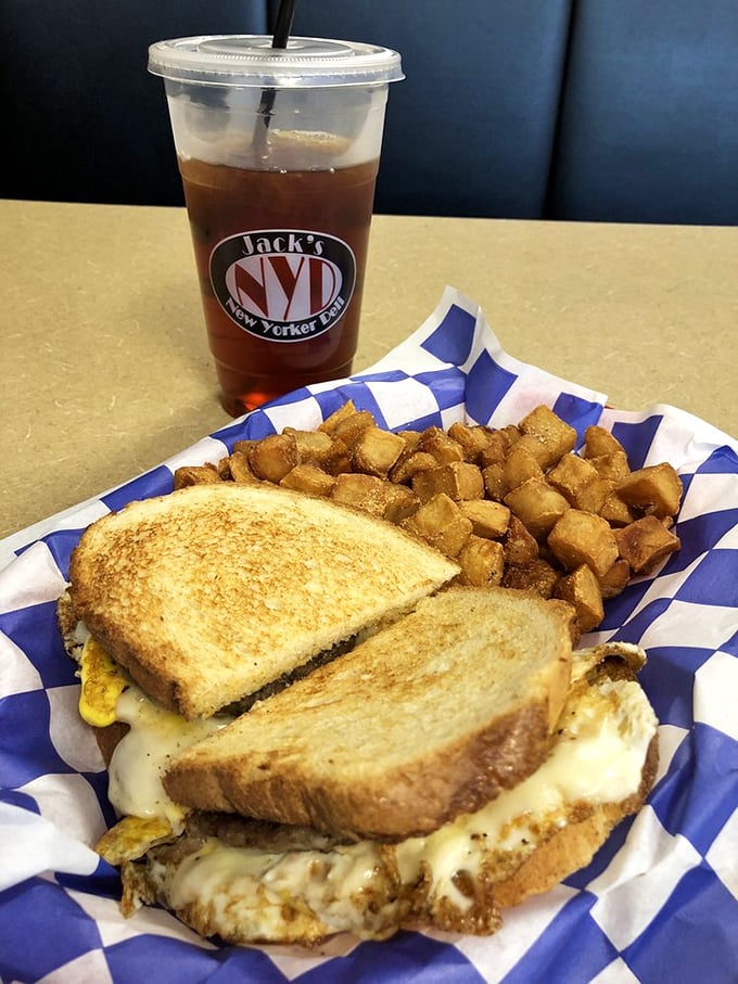 The breakfast sandwich and home fries combo – proof that mornings can actually be wonderful if they start with melted cheese and perfectly crisped potatoes.