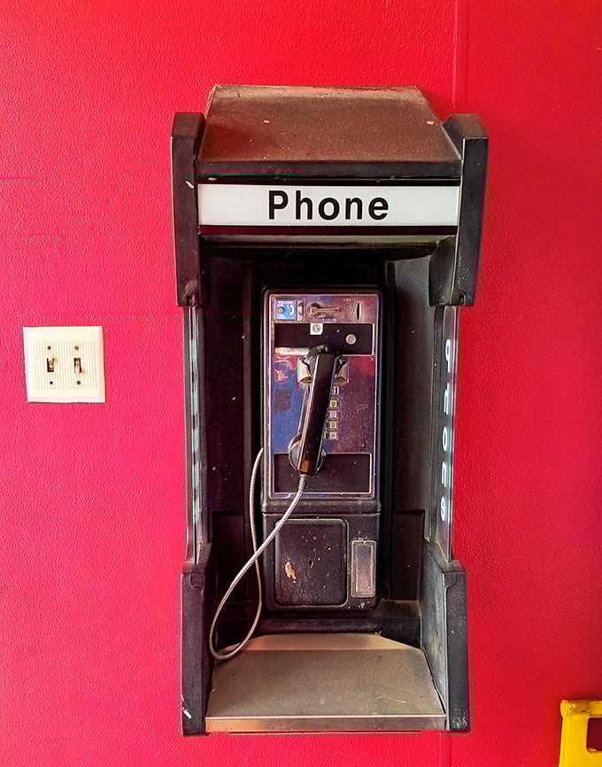 A payphone! Like finding a time machine next to your time-tested barbecue—some classics never go out of style.