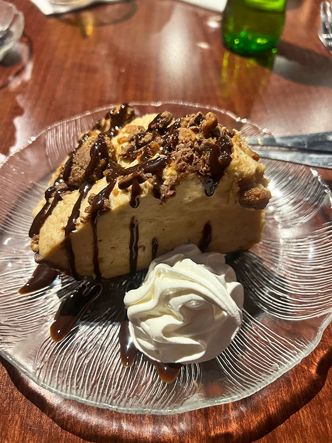 Peanut butter pie that makes sharing impossible – topped with chocolate drizzle that should be considered a work of art.