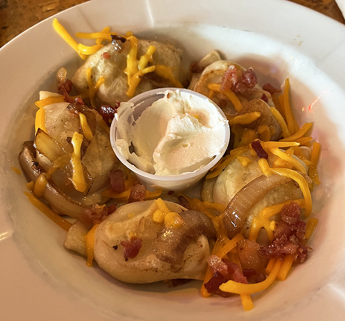 Pillowy pierogies swimming in butter with bacon bits and melted cheese—Polish grandmothers everywhere would give these their blessing.