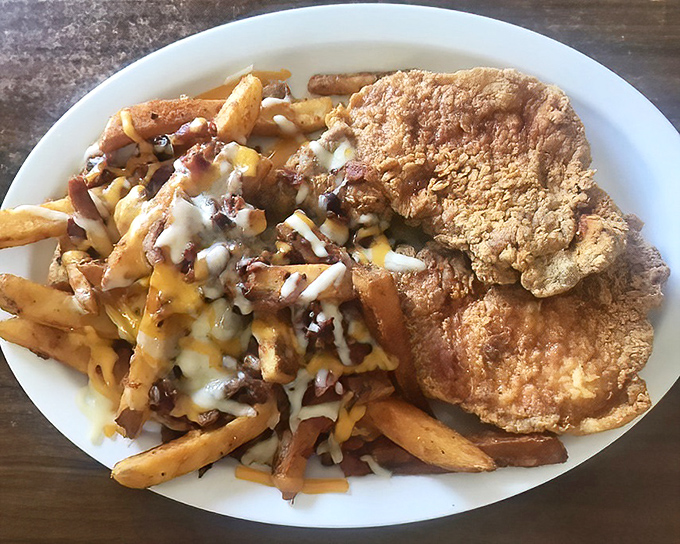 Country-fried perfection meets loaded fries—a plate that says "diet tomorrow" and "happiness today" in the most delicious way possible.