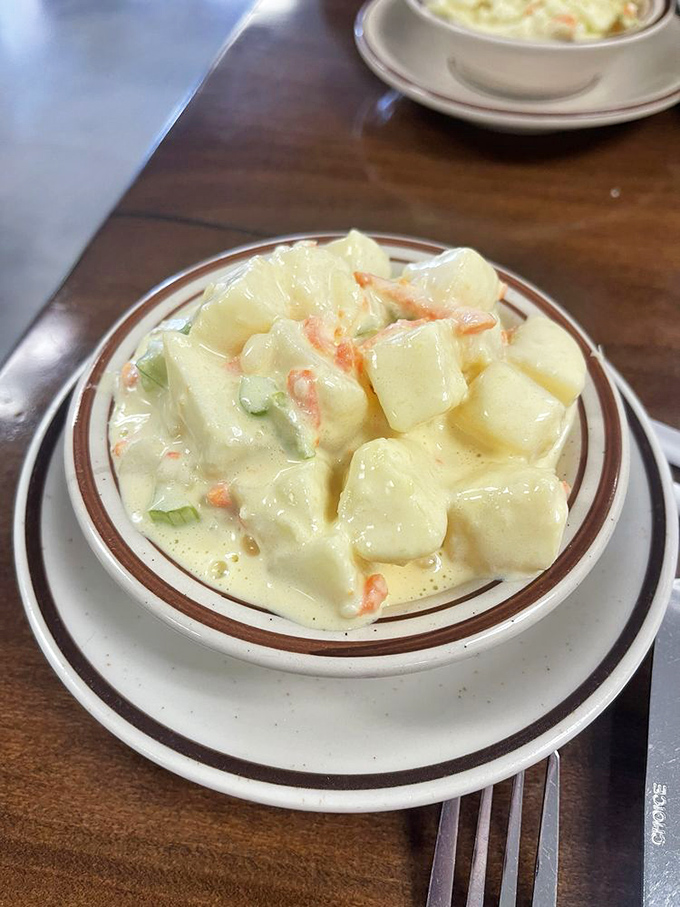 Potato salad that could start a family feud—creamy, perfectly seasoned chunks of potato that make you wonder why you ever ate the store-bought stuff.