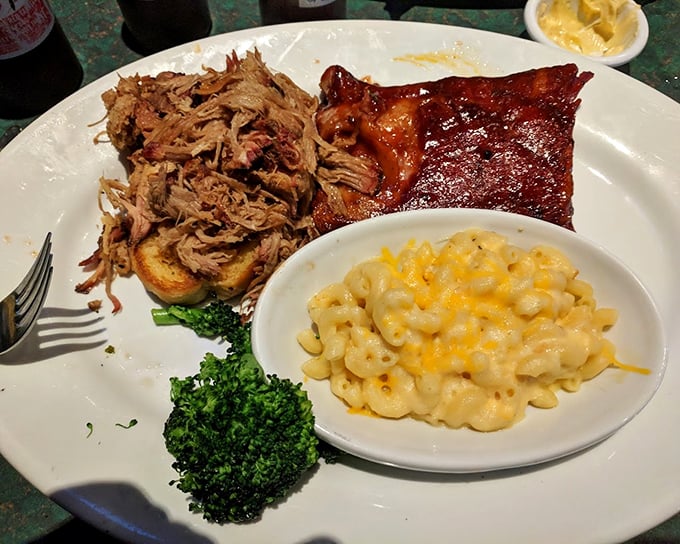 The barbecue trifecta – pulled pork, ribs, and mac and cheese on one plate – proof that sometimes the hardest life decisions are which meat to eat first.