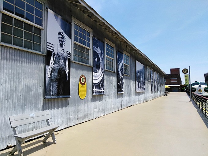 Historic photographs of railway workers line this exterior wall, silently telling the human stories behind the massive machines that built America's transportation network.