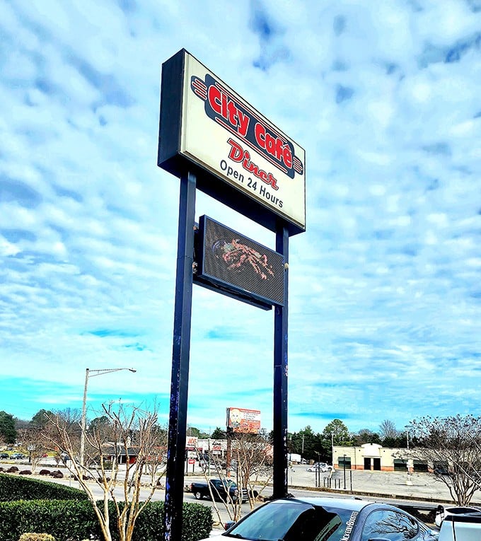 The roadside sign announces "Open 24 Hours"—three beautiful words that promise comfort food is available whenever cravings strike.