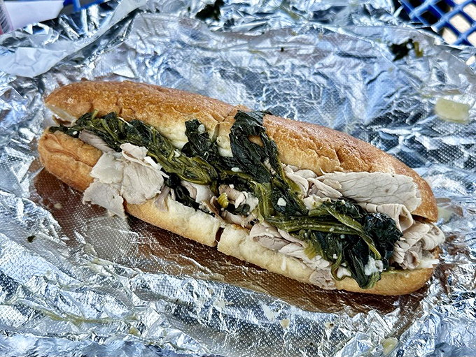 The classic roast pork with spinach—a sandwich so perfectly balanced it could teach yoga classes. Tender meat, bitter greens, crusty bread.