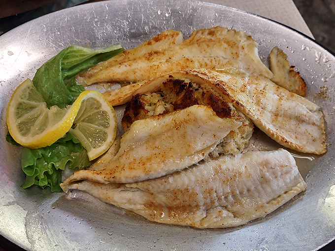 Delicate white fish fillets, perfectly seasoned and flanked by bright lemon wedges—simplicity that lets the ocean's flavors shine through.