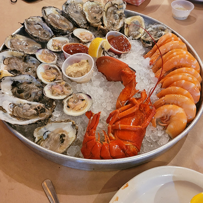 The seafood platter that launched a thousand Instagram posts. Oysters, shrimp, and lobster nestled on ice—ocean royalty holding court.