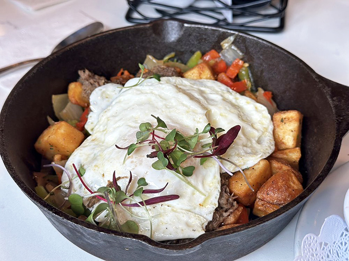 The short rib hash arrives in a cast iron skillet, as if to announce: "This isn't just breakfast—this is an event."
