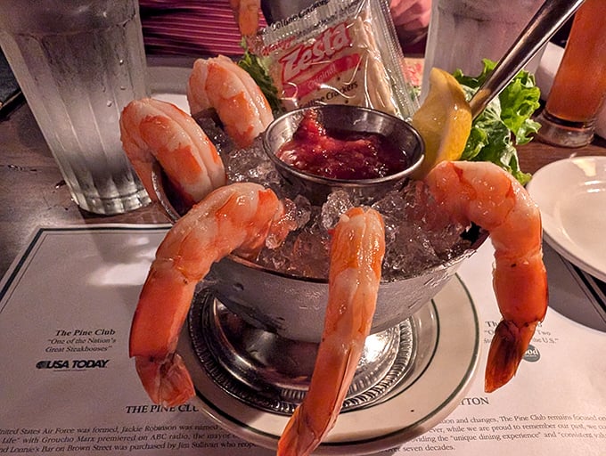 The shrimp cocktail—a retro starter that never needed reinvention. These plump beauties perched on ice are timeless for good reason.
