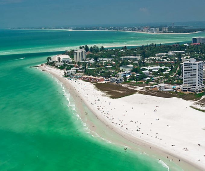 Siesta Key's famous white sand beach stretches like a ribbon of powdered sugar – where the Gulf of Mexico delivers fifty shades of blue, all of them spectacular.
