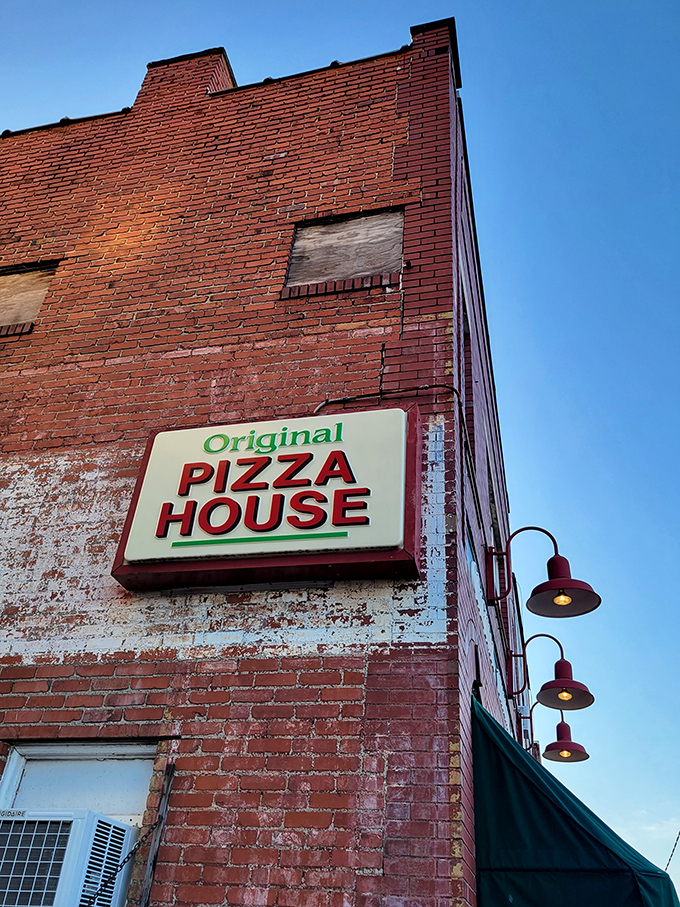 "Original Pizza House" – three simple words on a weathered brick building that promise more satisfaction than any fancy restaurant with a 12-page menu.