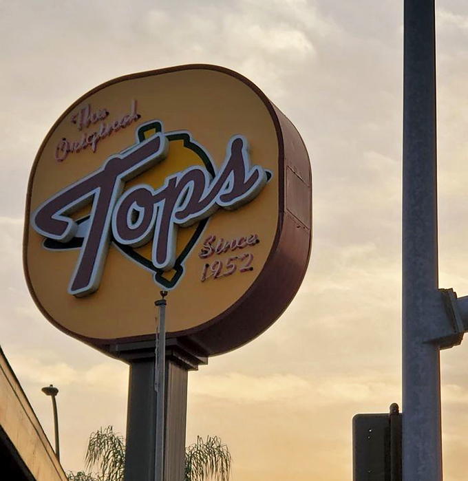 As dusk settles over Pasadena, the Tops sign glows like a beacon of hope for the hungry. Burger salvation awaits.