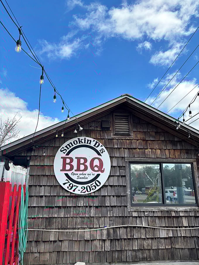 "Open when we're Smokin'" says it all. This weathered wooden exterior with string lights is the BBQ equivalent of a lighthouse guiding hungry souls home.