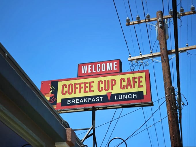 That classic sign against the blue California sky isn't just advertising—it's a beacon of breakfast hope, promising morning salvation to hungry passersby.