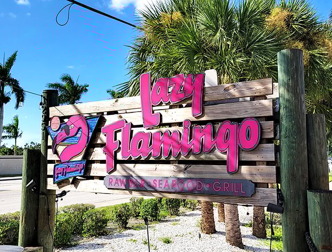 The sign promises three essential Florida food groups: raw bar, seafood, and grill—the holy trinity of coastal dining satisfaction.