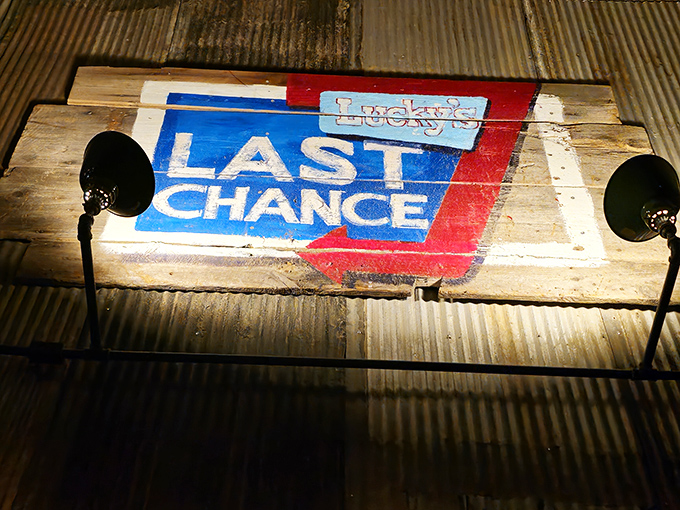 The Lucky's Last Chance logo painted on reclaimed wood – rustic charm that perfectly captures the vibe.