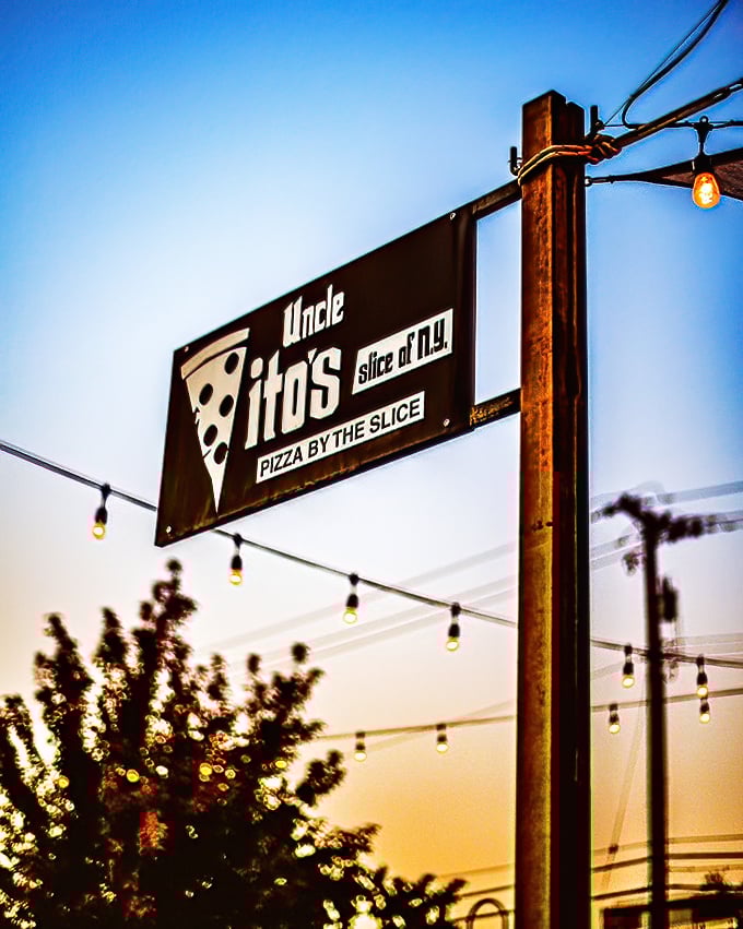 As the sun sets on Sacramento, Uncle Vito's sign glows like a pizza lighthouse, guiding hungry souls to their cheesy destiny.