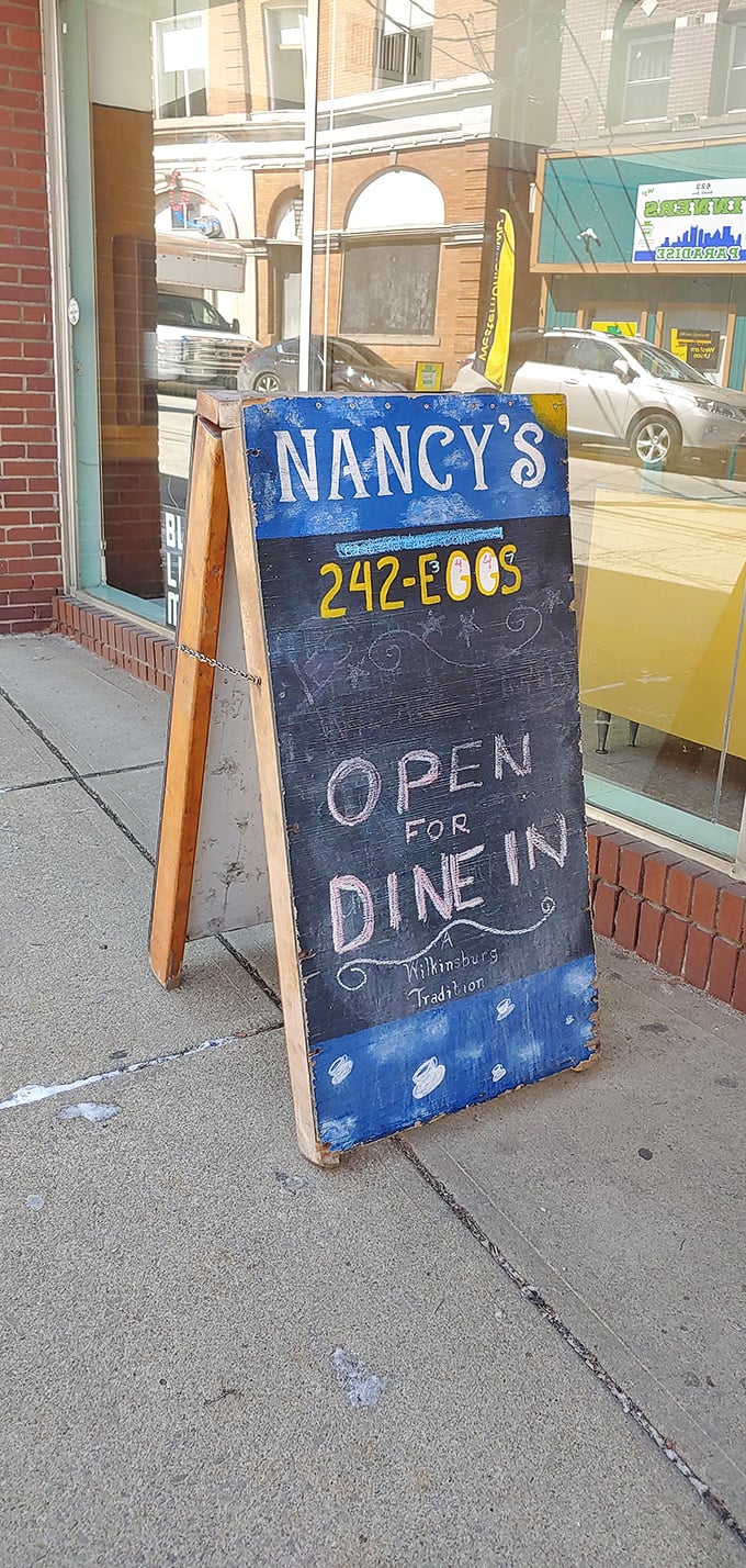 A sidewalk sign that doesn't lie – this place truly embodies the finest Wilkinsburg dining tradition.