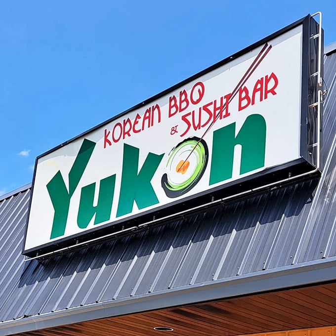 The bold signage against a blue sky – a beacon for hungry travelers and locals alike, promising culinary adventures under one roof.