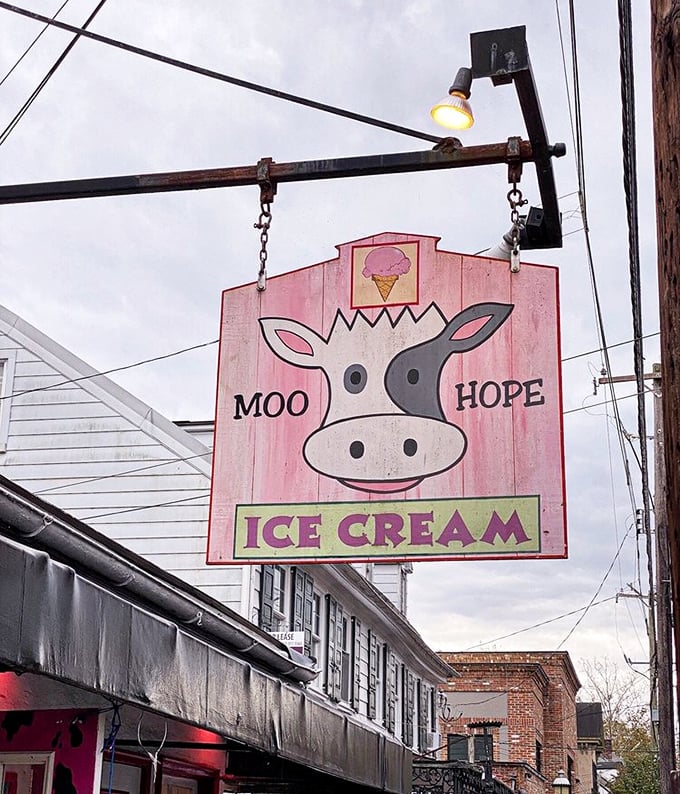 The iconic sign glows like a pink north star for dessert seekers. That smiling cow knows exactly what you're craving.