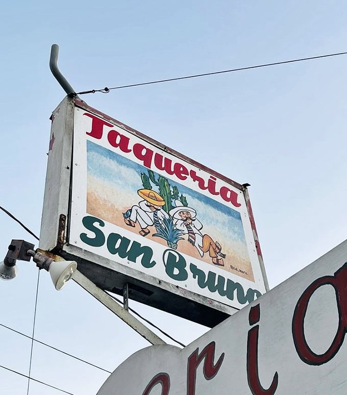 The weathered vintage sign has become an iconic beacon for taco lovers—a symbol that some of life's greatest pleasures come in the most unassuming packages.