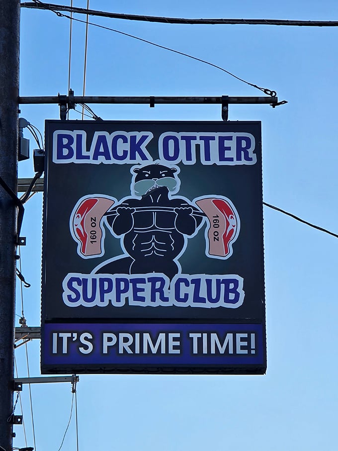 The sign says it all: "It's Prime Time!" at Black Otter Supper Club, where a muscular cartoon otter promises steaks as strong as his biceps.