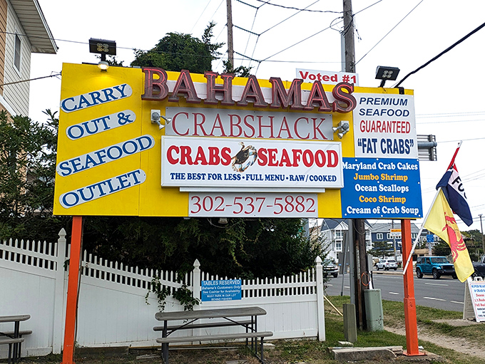 The sign that launched a thousand seafood pilgrimages. "The Best For Less" isn't just marketing—at Bahama's Crabshack, it's a solemn promise.