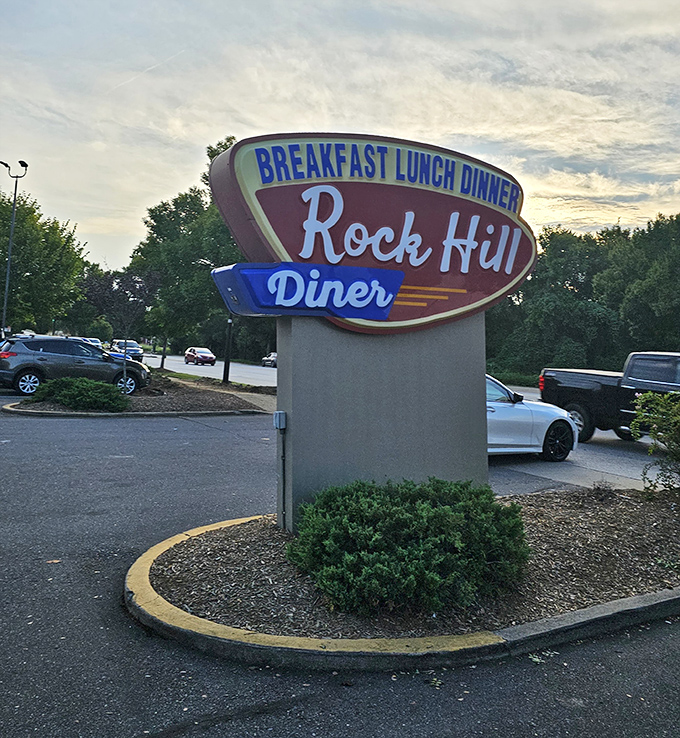 That classic neon sign beckons like a lighthouse for the hungry—a beacon of hope promising three square meals and zero pretension.