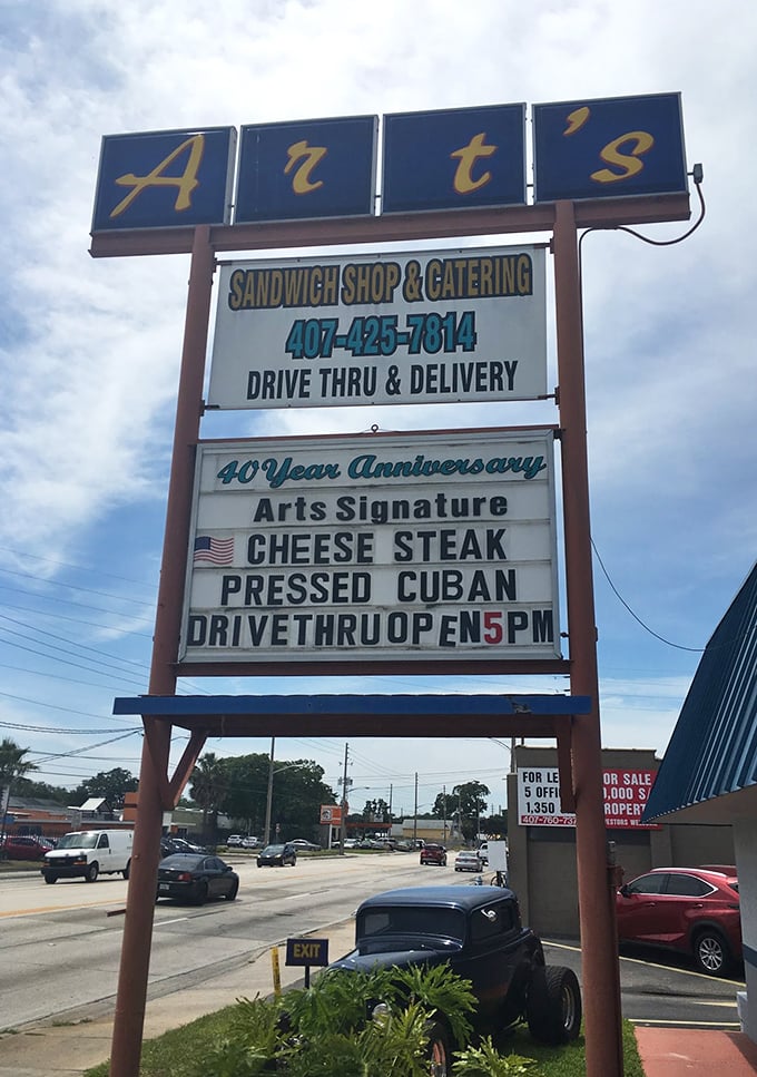 The roadside beacon that guides sandwich seekers home. This sign has directed more food pilgrimages than any GPS ever could.
