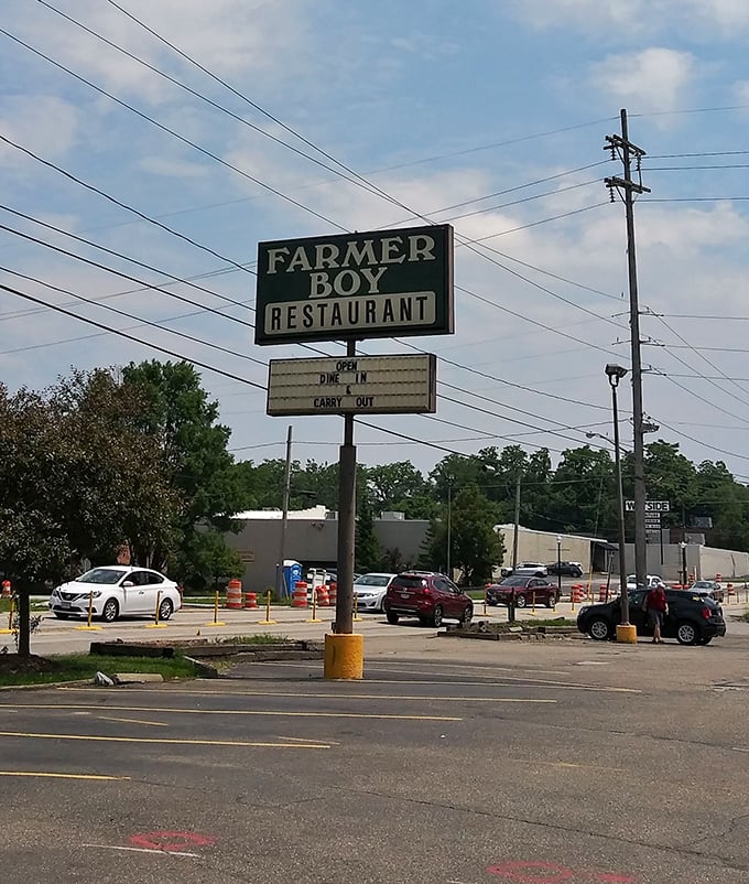 The roadside sign promising two essential services: "Dine In" and "Carry Out"—both leading to the same delicious destination.