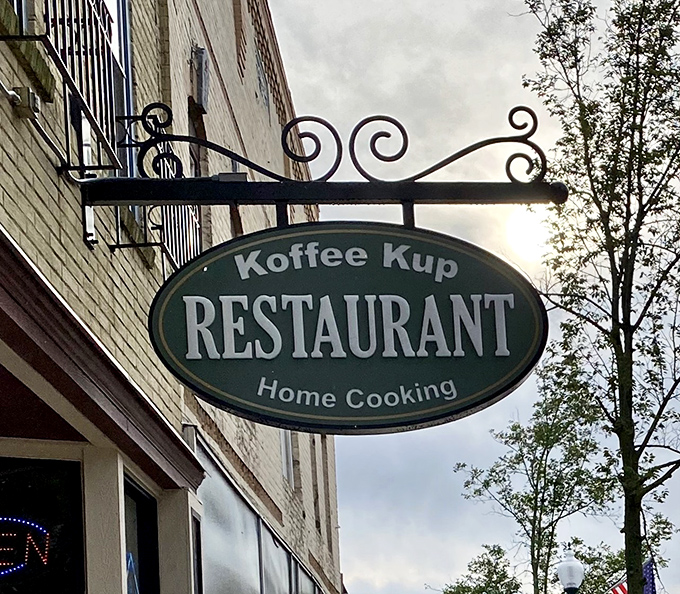 That ornate wrought-iron sign has pointed the way to breakfast bliss for generations – a beacon of hope for the hungry and caffeine-deprived.