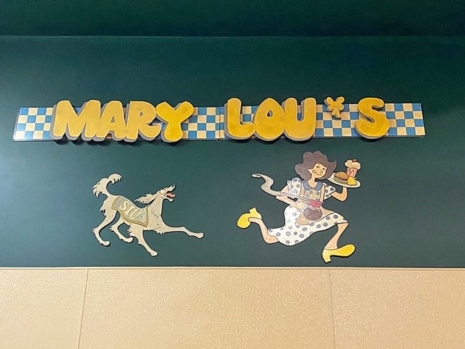 The whimsical sign featuring a running dog and waitress captures the playful spirit of this beloved institution. Some logos need no corporate redesign.