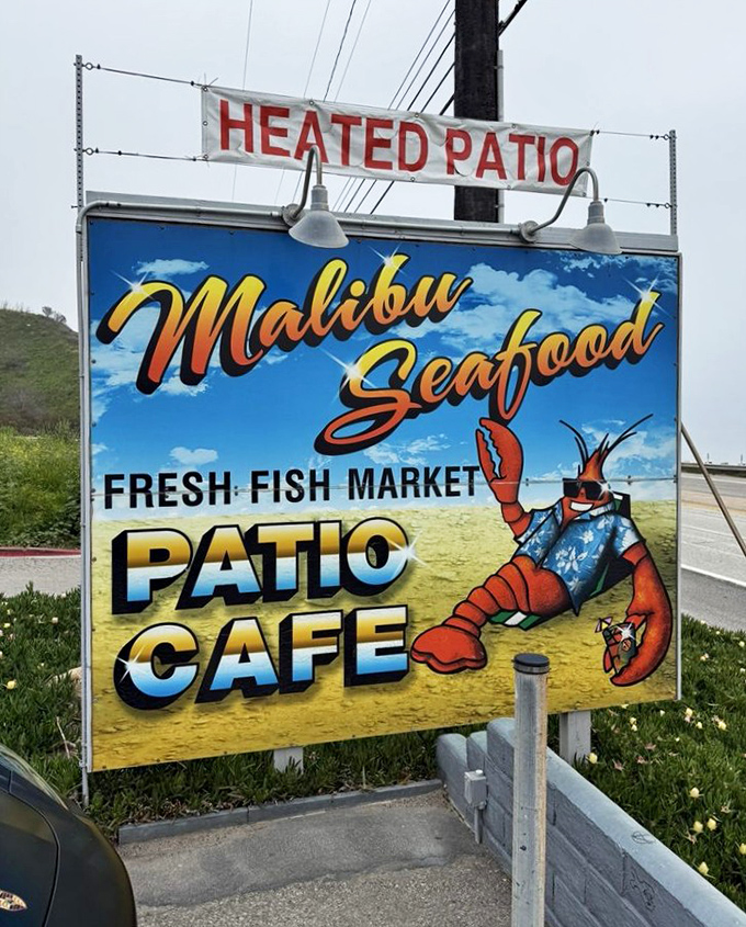The sign promises three essential things: fresh fish market, patio café, and heated patio. In Malibu, that's all you really need.