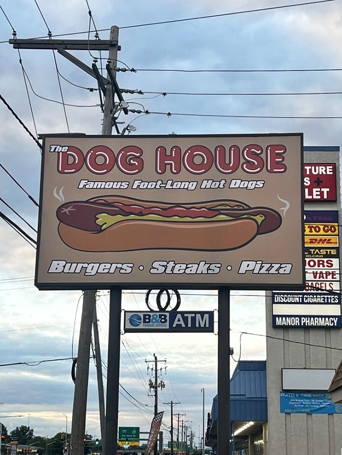 The roadside sign makes bold promises about their famous foot-long hot dogs—promises that the kitchen happily keeps with every order. 