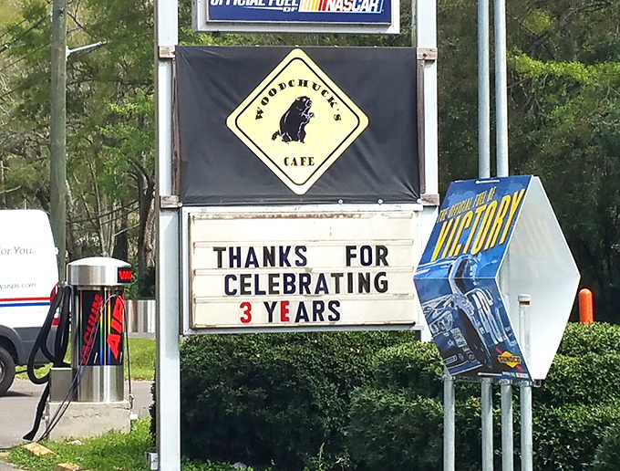 The roadside sign celebrating three years in business—a testament to surviving in an industry where many don't make it past their first birthday.