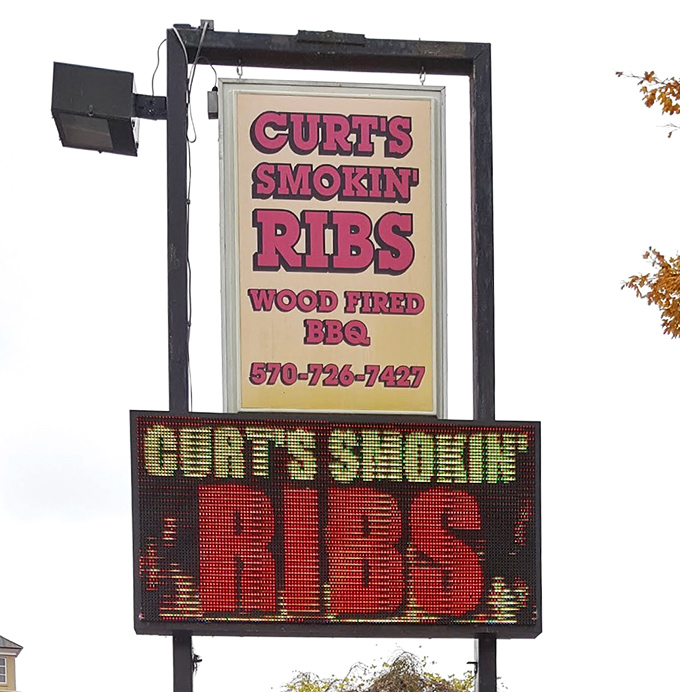 The sign doesn't just announce a restaurant – it's a beacon for those seeking refuge from a world of mediocre barbecue.