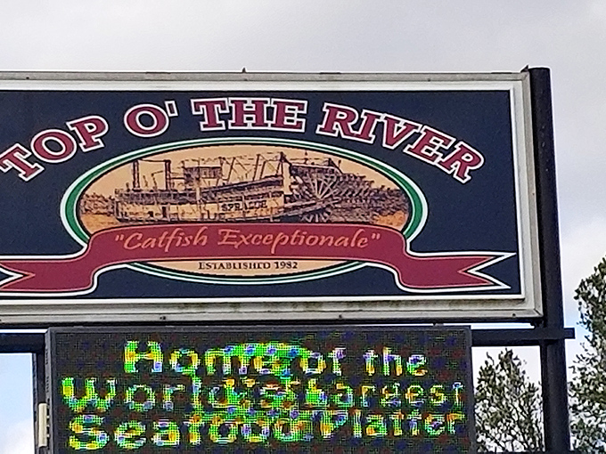 "Catfish Exceptionale" isn't just a slogan—it's a promise kept since 1982. That riverboat illustration hints at the Mississippi River heritage on your plate.