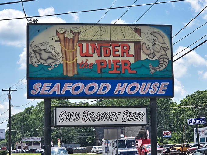 A sign that promises exactly what it delivers: seafood that makes you feel like you're dining under an actual pier, minus the sand in your shoes.