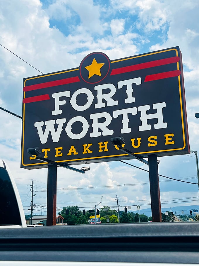 The Fort Worth Steakhouse sign stands tall against Tennessee skies—a beacon for hungry travelers and locals alike seeking beef-based bliss.