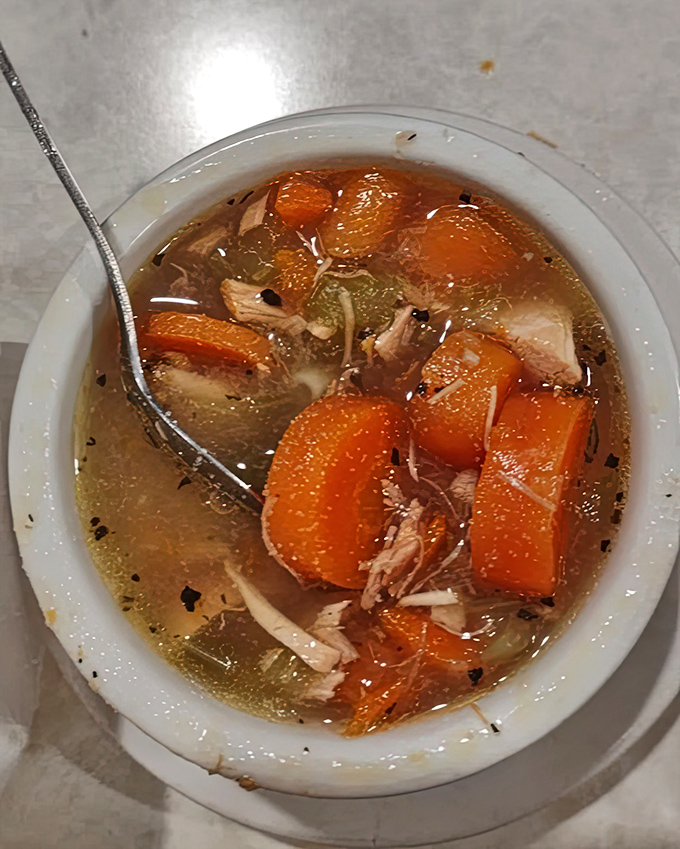 Homemade soup that would make your grandmother nod in approval – chunks of chicken and carrots swimming in broth that tastes like someone cared.